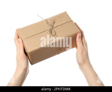Woman holding parcel wrapped in kraft paper with tag on white ...