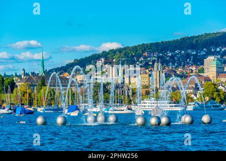 Panorama of Swiss town Zuerich behind Springbrunnen fountain Stock ...