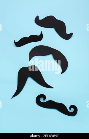 Set of different paper mustaches on color background. Father's Day ...