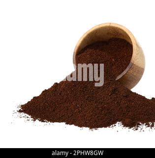 Overturned wooden bowl with coffee powder isolated on white background ...