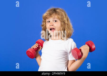 Sport children. Child with strong biceps muscles. Sport exercise for kids. Sporty children ...