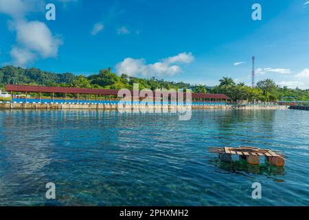 The pier with the signn Pelabuhan - harbor- Raja Ampat of Waisai at ...