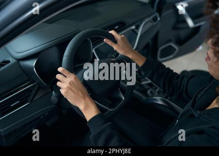 Woman behind steering wheel of modern car Stock Photo - Alamy