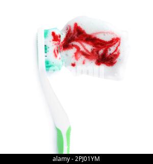 Toothbrush with paste and blood on white background. Gum inflammation ...