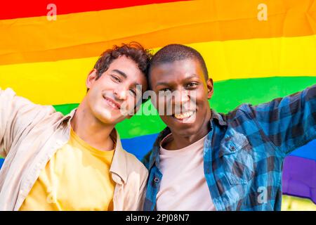 Cropped shot of LGBT couple holding hands in a forest. Summer,spring ...