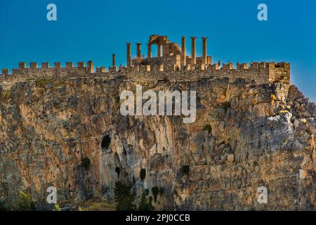 Acropolis of Lindos on a steeply rising cliff above the town, Rhodes ...