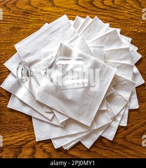 A glass on top of a bunch of napkins Stock Photo - Alamy