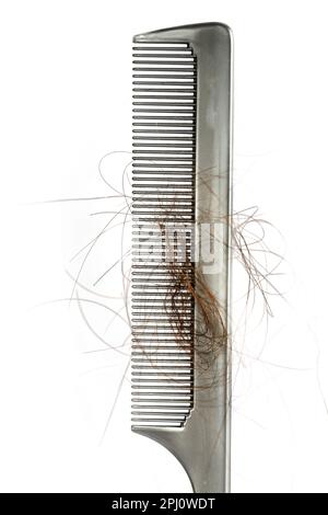 Strands of fallen hair wound on a thin comb, isolated on a white ...