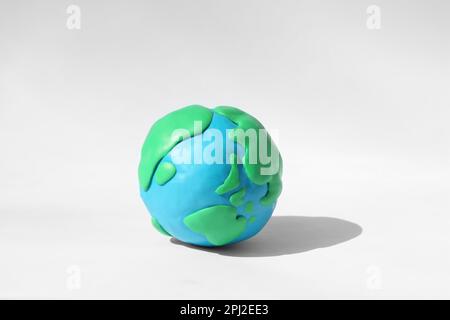 Planet Earth model made of plasticine, on the end of a pencil Stock ...