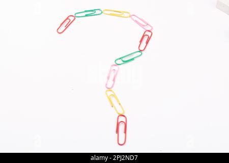 Question mark created by paperclip on white background Stock Photo - Alamy