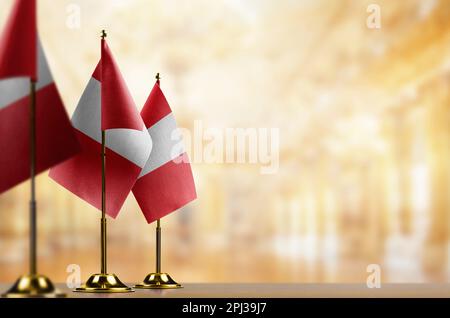 Small flags of the Peru on an abstract blurry background Stock Photo ...