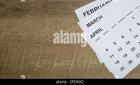 white calendar on brown background Stock Photo - Alamy