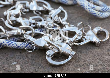 Climbing rope with carabiners on asphalt, top view Stock Photo - Alamy