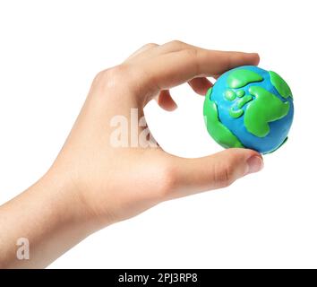 Woman holding plasticine model of planet Earth on white background ...