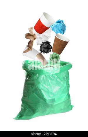 Different plastic garbage falling into trash bin. Waste management and ...