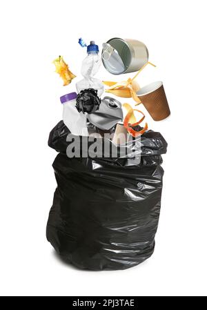 Different plastic garbage falling into trash bin. Waste management and ...