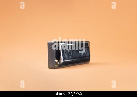 Hohner Rocket professional diatonic harmonica backside. On a light ...