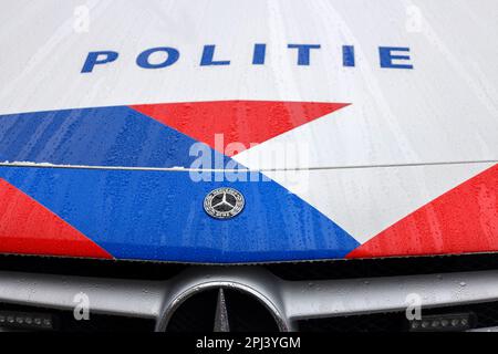 Logo and striping in front of dutch police (politie) car in the ...
