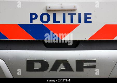 Logo and striping in front of dutch police (politie) car in the ...