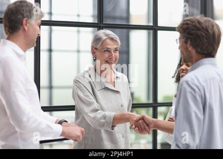 Conversation between managers and employees in the office Stock Photo ...