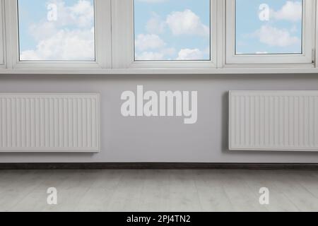 Modern office with window and radiators. Interior design Stock Photo ...