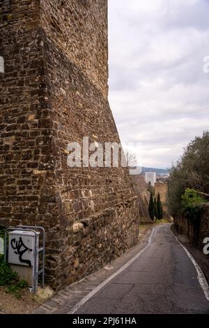 Surviving ancient city walls of Florence on Via di Belvedere around the ...