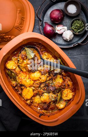 Braised beef stew with tomato and potato served with steamed rice ...