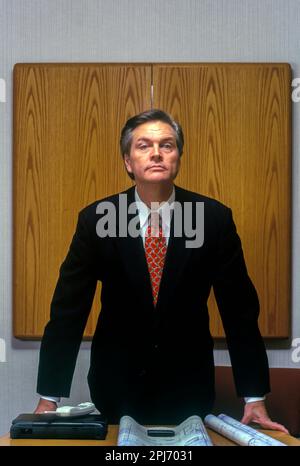 1996 HISTORICAL MALE OFFICE WORKER WITH CONSTRUCTION PLANS Stock Photo ...