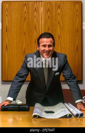 1996 HISTORICAL MALE OFFICE WORKER WITH CONSTRUCTION PLANS Stock Photo ...