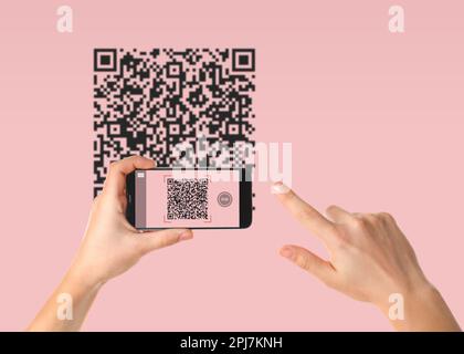 Barcode QR on a pink background close up Stock Photo - Alamy