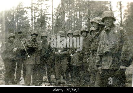 German Soldiers of the 6th SS Mountain Division Nord dressed in ...