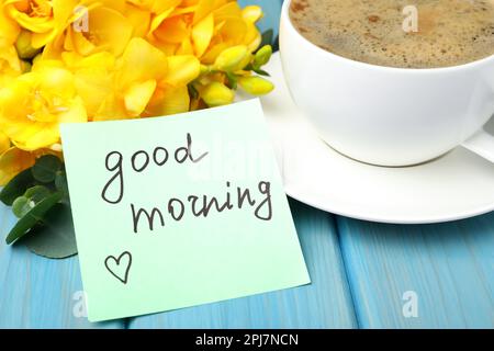 Beautiful freesias on wooden table Stock Photo - Alamy