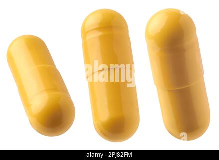 yellow gelatin pills on white background Stock Photo - Alamy