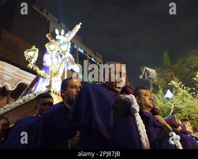 Devotees carrying a religious image leading the Friday of Sorrows ...