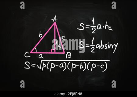 Basic triangle area formulas written on chalkboard Stock Photo - Alamy