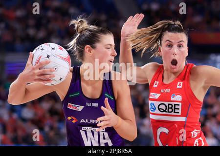 Maddy Proud of the Swifts and Lara Dunkley of the Firebirds compete for ...