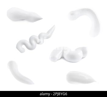 Set with smears of toothpaste on white background, top view. Banner ...