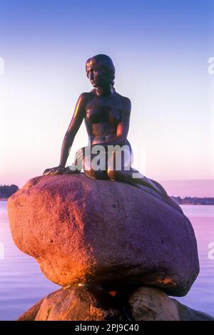 The Little Mermaid (1913) - bronze sculpture by sculptor Edvard Eriksen. The mermaid sits on a ...