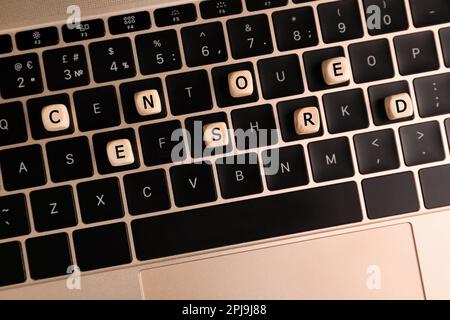 Wooden cubes with word Censored, keyboard and computer mouse on black ...
