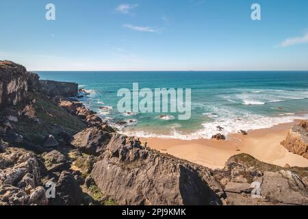 Rocks surround the sandy beach of Praia do Malhao Sul on the Atlantic ...