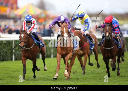 Doddie's Impact (left) ridden by jockey Billy Loughnane on their way to ...