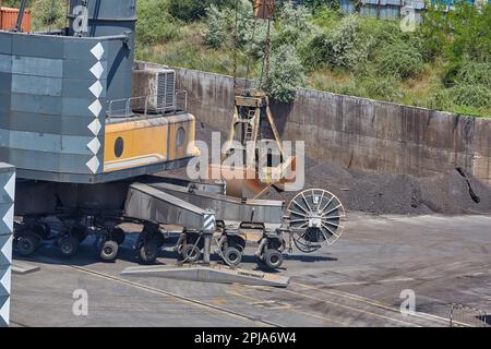 Operations with coal in seaport. Loading coal on bulk carrier. Coal ...