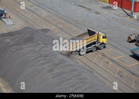 Operations with coal in seaport. Loading coal on bulk carrier. Coal ...