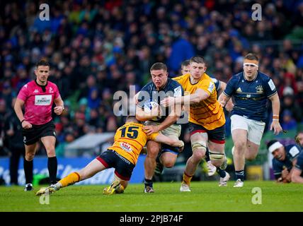 Leinster Rugby's Scott Penny (centre) is tackled by Ulster Rugby's ...