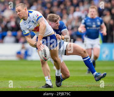 Warrington Wolves Matt Dufty is tackled by a defender during the Super ...