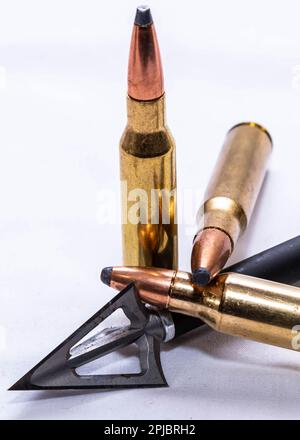 Three different caliber hunting rifle bullets on a white background ...