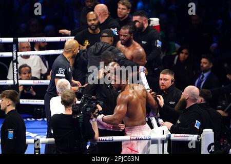 Anthony Joshua is pulled away by referee Marcus McDonnell after ...