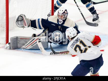 Florida Panthers forward Nick Cousins, left, controls the puck in front ...