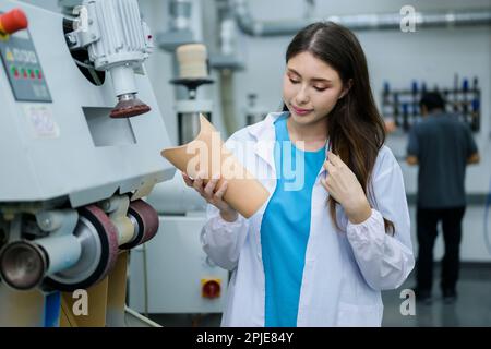Technician making prosthetic limb using grinder to smooth socket Stock ...