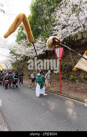 Tatsuno springtime samurai parade marching along a small road under ...